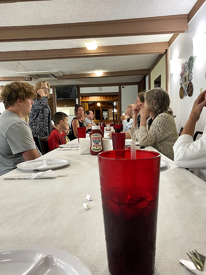 Generations gather around tables where the conversation flows as freely as the sweet tea and chicken keeps everyone smiling.