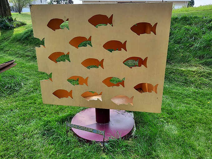 Fish-shaped cutouts prove that even marine life can be reimagined in steel, swimming through air instead of water in this whimsical wonderland.