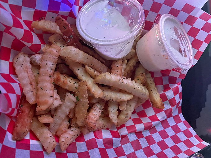 Crispy, herb-dusted fries arrive in checkered paper &ndash; the perfect finger food for maintaining your pinball stamina through marathon gaming sessions.