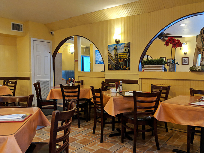 The dining room's warm yellow walls and arched doorways create an atmosphere that says "relax, you're family now" &ndash; comfort food deserves a comfortable setting.