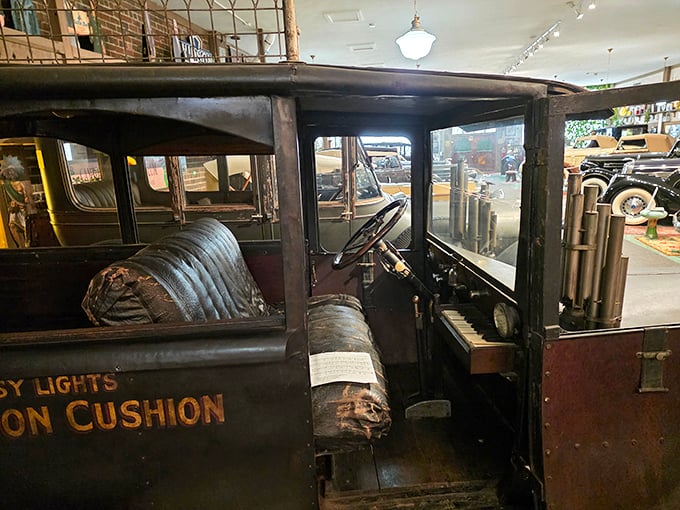 Peek inside this vintage beauty and imagine gripping that wooden wheel, listening to the engine's mechanical symphony as you cruise through history.