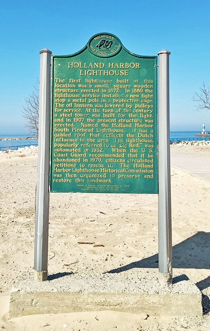 The historical marker shares Big Red's story, from its construction in 1907 to its role in Holland's maritime heritage and eventual beloved landmark status.