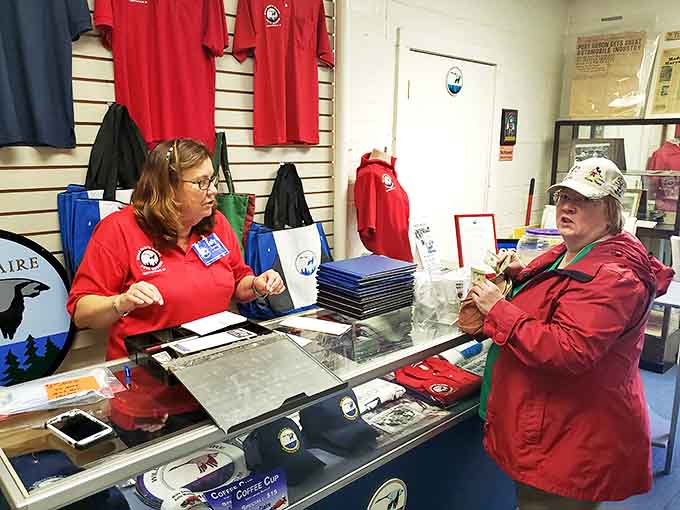 The museum's merchandise counter offers more than souvenirs &ndash; it's where passionate volunteers share stories that bring automotive history to life.