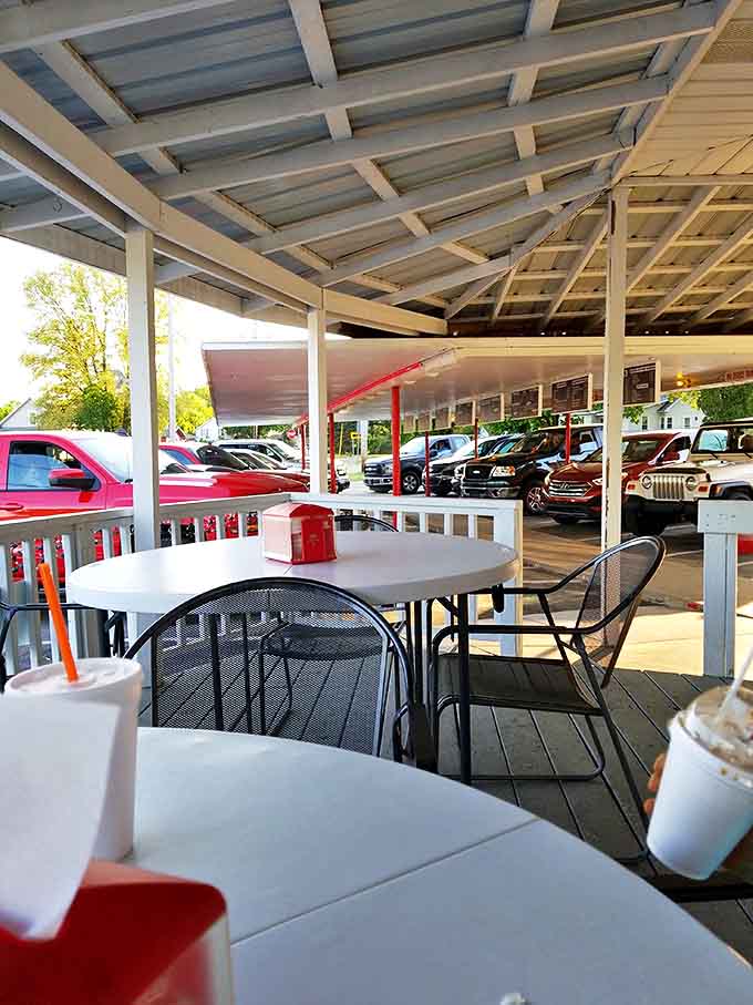Simple white tables on the covered patio provide the perfect spot to watch small-town life unfold while enjoying a burger and that famous root beer.