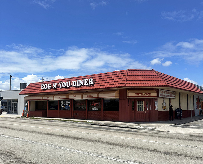 The diner's corner location makes it an unmistakable landmark, with its distinctive red roof visible to hungry travelers from blocks away.