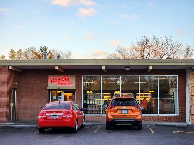 The storefront at dusk &ndash; that warm glow promising comfort and sweetness even as the day winds down.