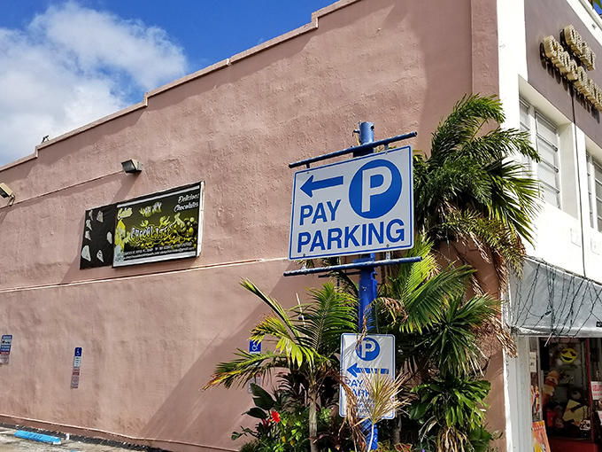 Outside, palm trees frame the unassuming exterior &ndash; a humble facade that gives no hint of the sensory carnival waiting inside.