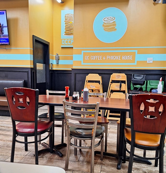 Warm yellow walls and thoughtful decor create an atmosphere that feels like a hug before your food even arrives.