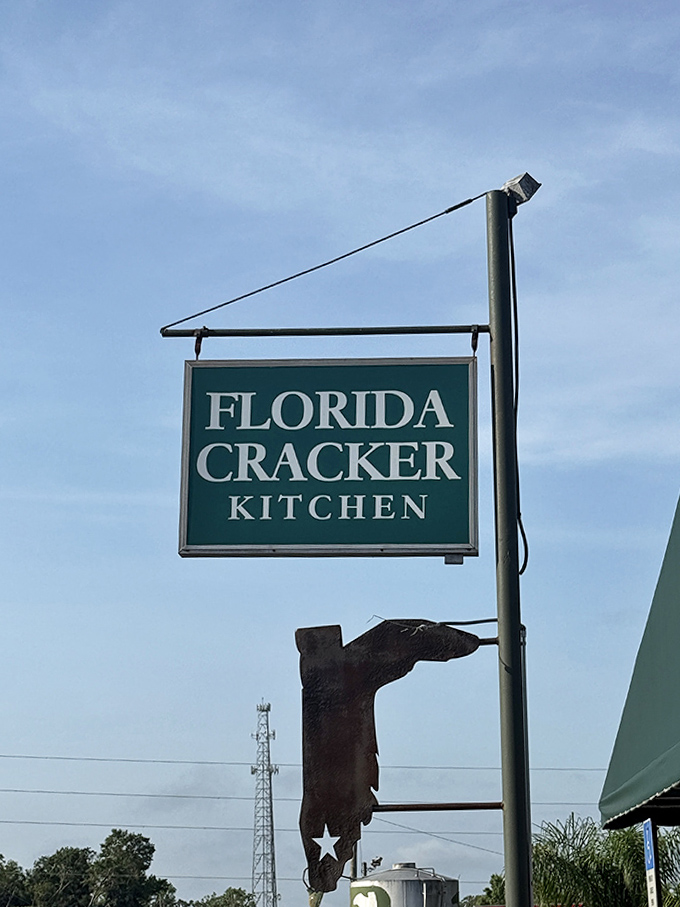 The iconic Florida Cracker Kitchen sign stands as a beacon for hungry travelers seeking authentic Florida cuisine in the heart of Brooksville.