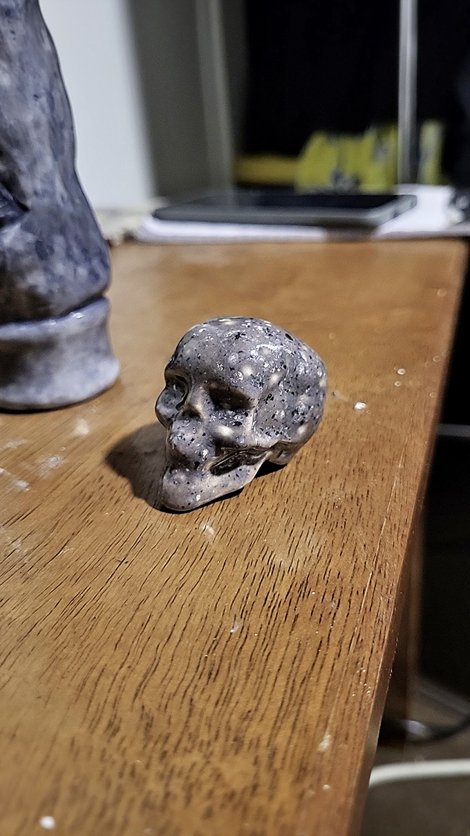 This little carved skull sits among cheerier items, a memento mori reminding browsers that even the quirkiest collections have a touch of mystery.