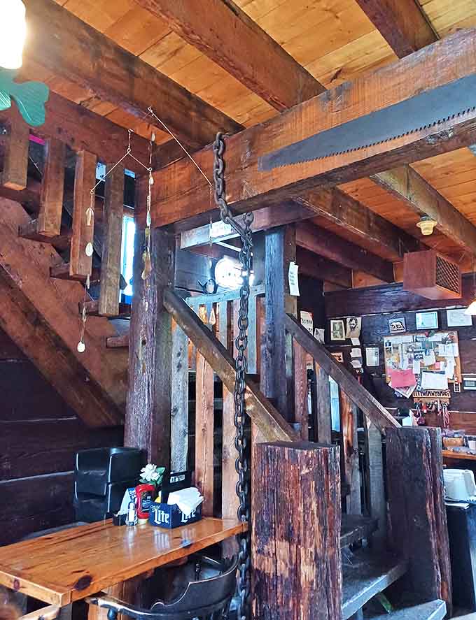 Massive timber beams and iron chains form a staircase that's survived decades of boots and stories &ndash; architectural character you can't manufacture.