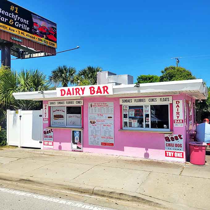 The Dairy Bar's pink fa&ccedil;ade stands as a beacon of hope for hungry travelers, promising sweet relief and savory satisfaction just steps away.