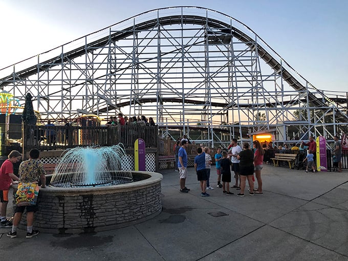 The setting sun casts a golden glow over Stricker's Grove, transforming the modest amusement park into an enchanted playground of light and shadow.