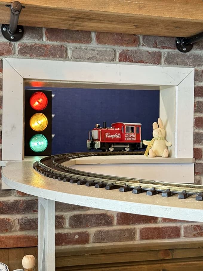 A miniature train chugs along its track near the bar, delighting kids and adults alike with its charming presence and nostalgic appeal.