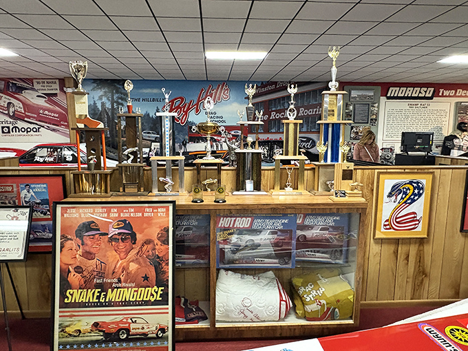 Trophy cases filled with gleaming hardware tell stories of victory, while vintage racing posters remind us when "Snake" and "Mongoose" were more than just animals.