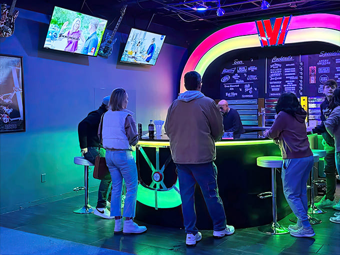 Patrons gather at the neon-lit bar, swapping stories of epic wins and devastating "Game Overs" between sips.