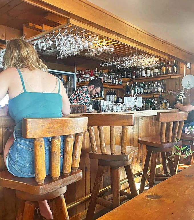 The bar area invites lingering conversations and "just one more" moments, where skilled bartenders craft drinks worthy of the food they accompany.