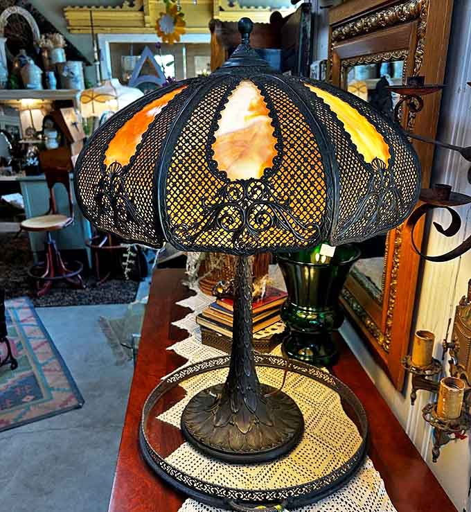 This stunning vintage lamp with its intricate metalwork and amber panels casts the kind of warm glow that makes everything &ndash; and everyone &ndash; look better.