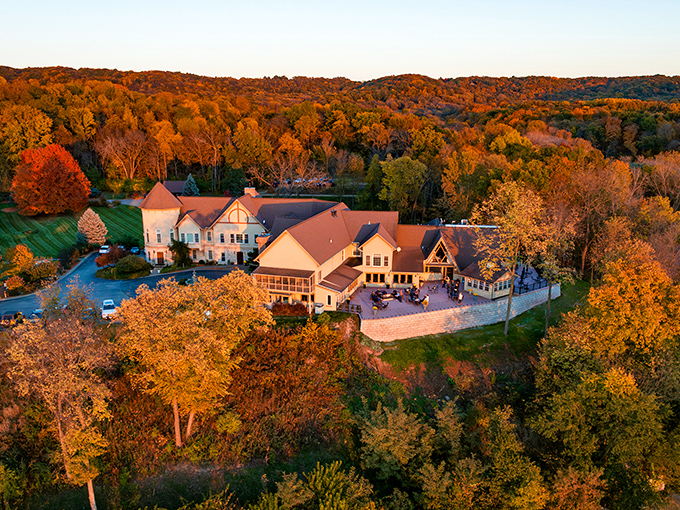 Aerial View: From above, the Goldmoor reveals its perfect positioning, a crown jewel set amid autumn's fiery display of red and gold.