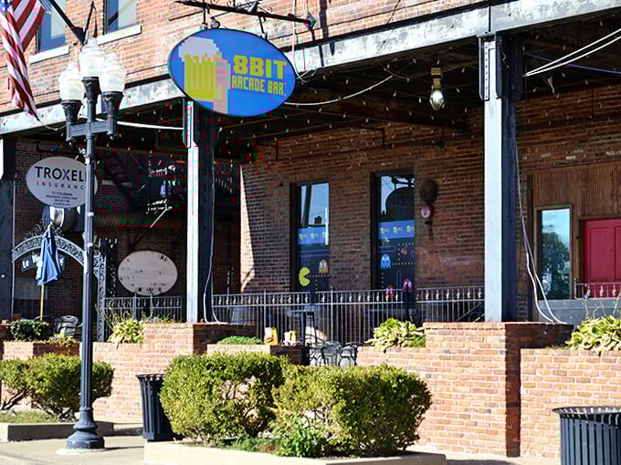 The welcoming storefront of 8 Bit Arcade Bar promises an evening where adults can rediscover the simple joy of play.