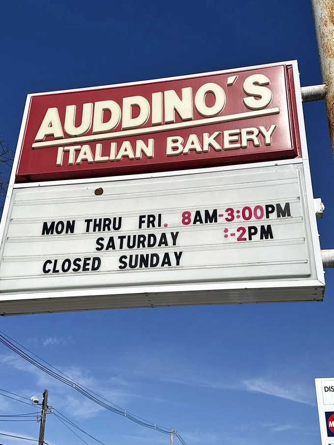 The bakery's hours posted clearly&mdash;because knowing exactly when you can get your fritter fix is essential life information.
