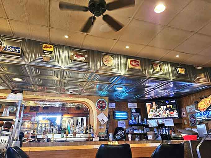 The bar gleams with promise, where Detroit's finest brews stand ready to complement the city's most iconic pizza experience.