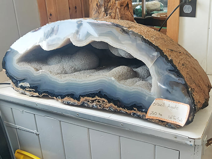 This massive Brazilian agate geode reveals concentric banding and crystalline centers, showing how minerals deposited in rhythmic layers over countless years.