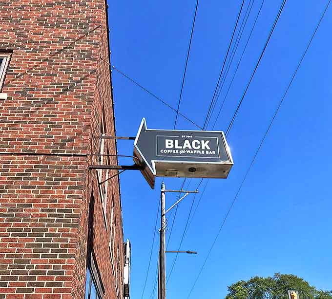 The BLACK Coffee and Waffle Bar sign points the way like a beacon of breakfast hope against the Minneapolis sky.