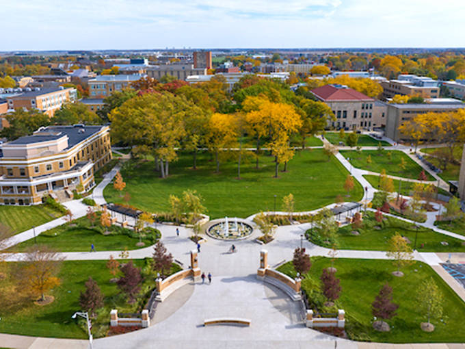 Bowling Green State University's campus creates a verdant heart for the community, where pathways converge at a central gathering space perfect for both studying and socializing.