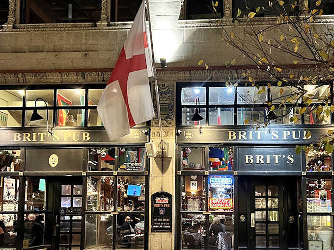 As evening approaches, Brit's exterior glows with warm light, the St. George flag standing sentinel as patrons gather for food, drinks and camaraderie.