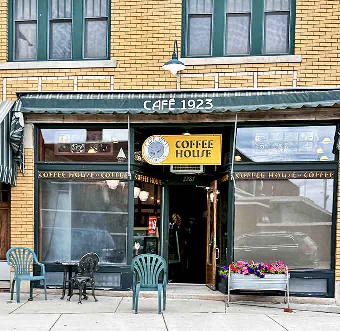 That green and yellow exterior announces that something special lives here, like a building wearing its Sunday best every single day.