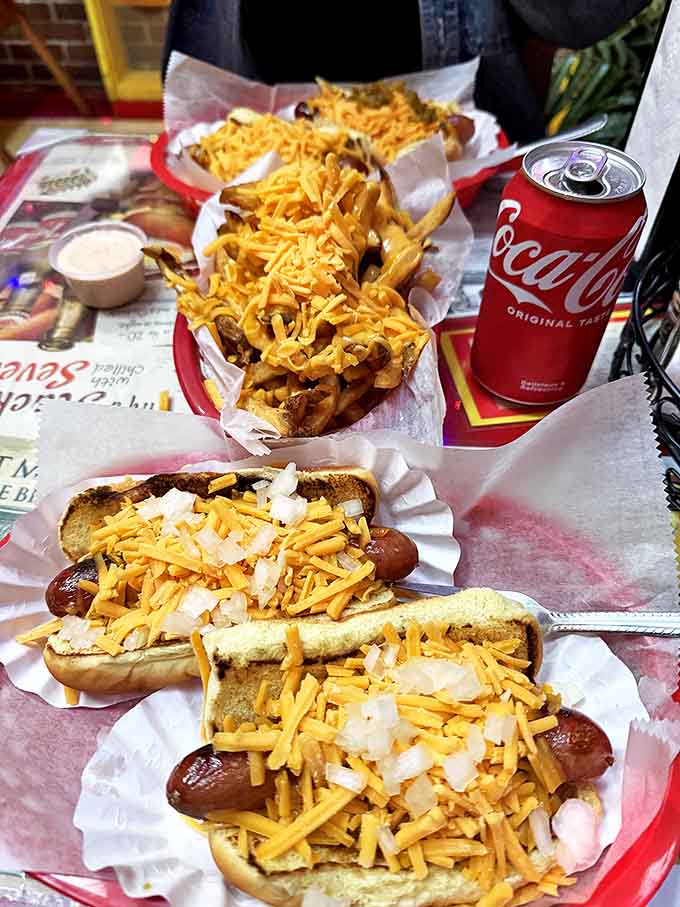 A parade of perfectly dressed dogs marches toward hungry diners, each one a testament to O'Betty's commitment to elevating street food to art.