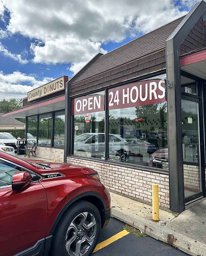 That "Open 24 Hours" sign isn't just decoration, it's a promise that fresh donuts await whenever your cravings strike, day or night.