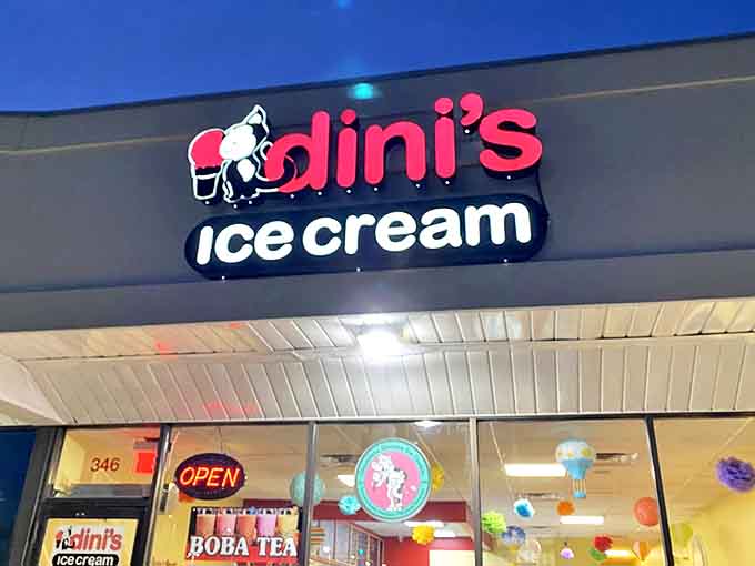 The distinctive Dini's logo featuring a cartoon cow with ice cream cone glows invitingly against the twilight sky &ndash; a sweet landmark in Roselle.