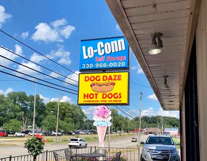 That bright yellow sign practically shouts from the roadside, making sure hungry travelers know exactly where to find hot dog paradise.