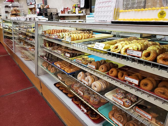 The display case of dreams &ndash; rows of freshly made donuts standing at attention, ready to make someone's day a little sweeter.