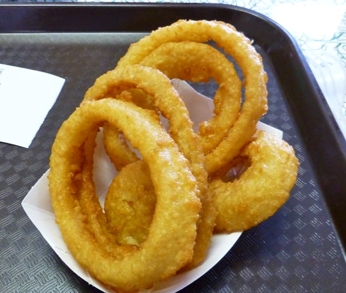 Crispy onion rings form perfect golden halos &ndash; sweet onion interiors encased in shattering batter that puts fast food versions to shame.