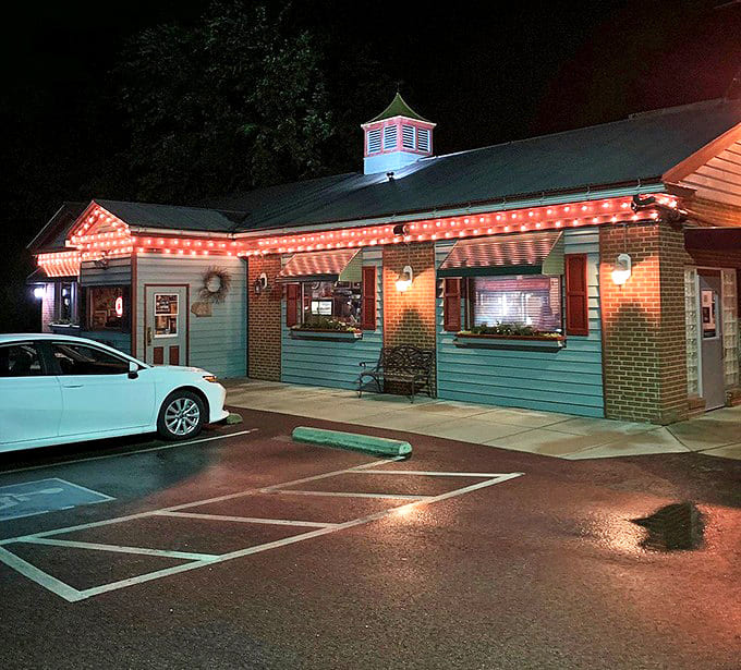 After dark, Gasoline Alley transforms into a glowing oasis of warmth and hospitality, string lights outlining its distinctive silhouette.