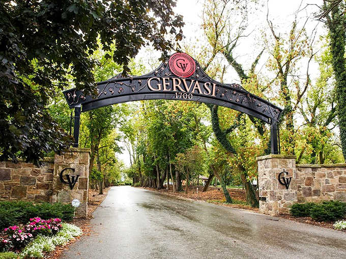 The wrought-iron archway announces your arrival to wine country, where the everyday world falls away and Tuscan dreams await just down that tree-lined drive.