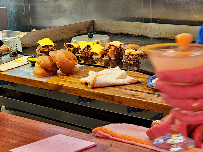 Grill Top: Behind the scenes, the busy grill station transforms simple ingredients into extraordinary meals, with burgers sizzling to juicy perfection.