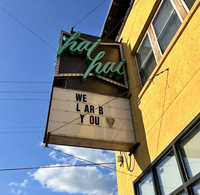 The neon sign doesn't just announce a restaurant&mdash;it promises an experience, with playful messages that set the tone before you even step inside.