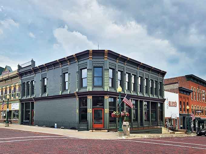The meticulously restored Kraft Building anchors a corner of Mount Carroll's downtown, its distinctive green facade standing out among the brick.