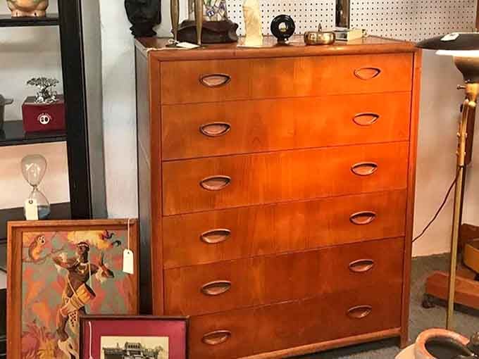 Mid-century dressers with those distinctive pulls that scream 1960s sophistication, ready to organize someone's life with serious style.