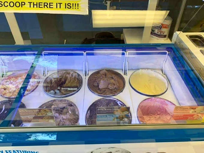 The display case presents tough choices in frozen form, where every flavor looks equally tempting and decision paralysis becomes a delicious kind of problem.