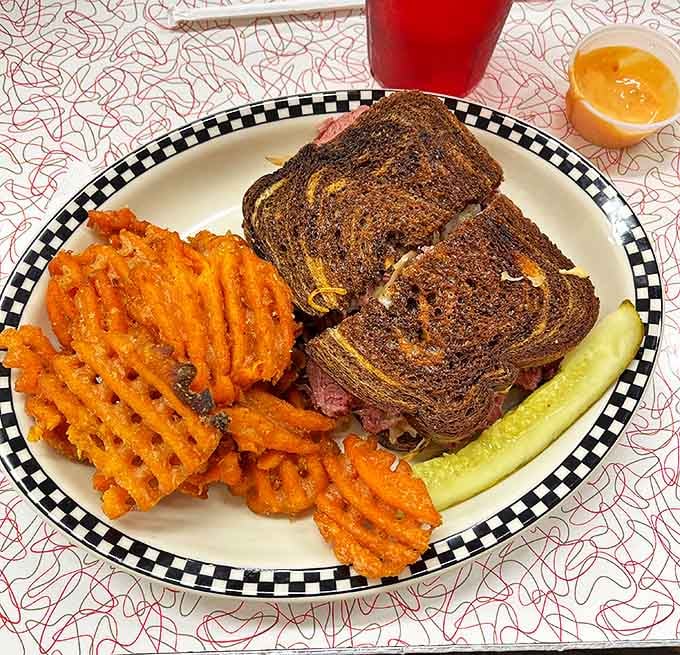 A skyscraper of corned beef and sauerkraut that makes you grateful for whoever invented the sandwich and napkins in equal measure.