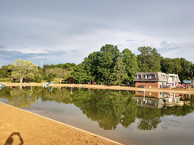 The spring's crystal waters invite swimmers to float away summer afternoons, suspended between sky and earth in Ohio's most refreshing escape.