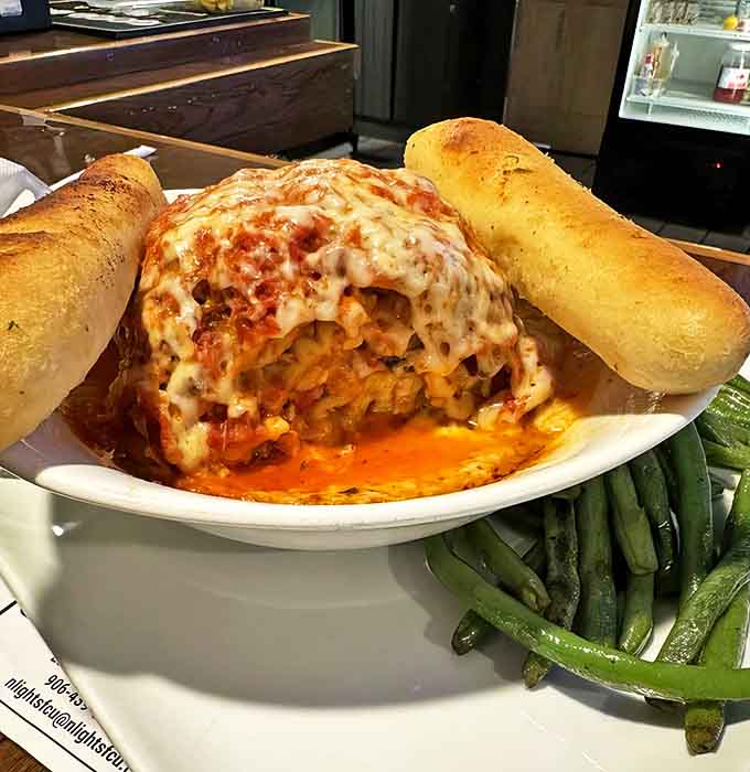 This isn't just lasagna &ndash; it's a towering monument to cheese, pasta, and sauce that would make any Italian grandmother nod in approval.