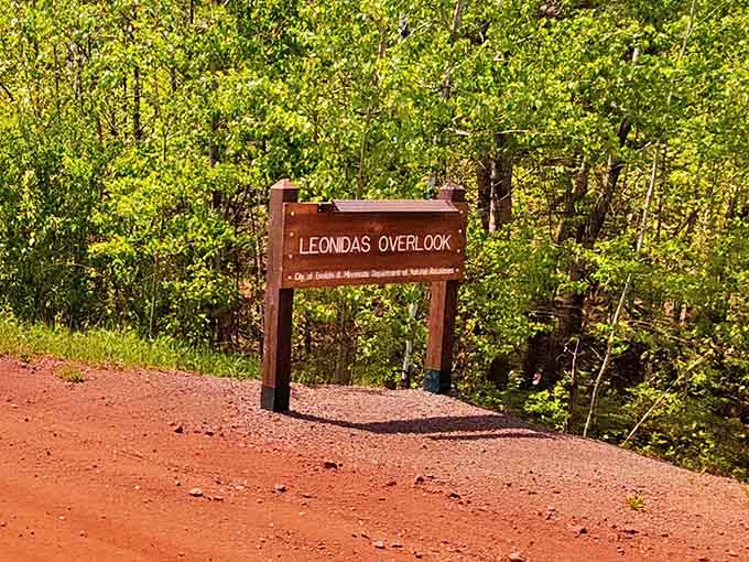 A humble wooden sign marks the entrance to one of Minnesota's most spectacular viewpoints, a gateway to industrial history and natural wonder.