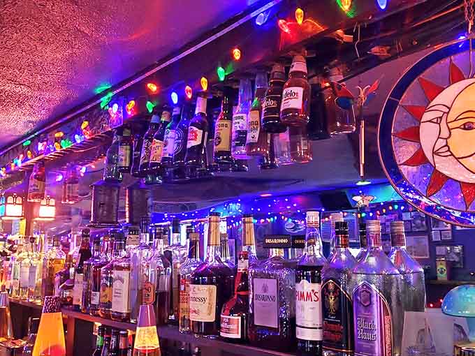 The bar glows like a beacon, drawing music lovers and good-time seekers into its welcoming embrace.
