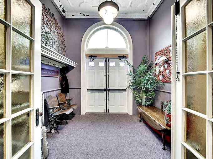 The entryway welcomes visitors with stained glass accents and period details that set the tone for this historic stay.